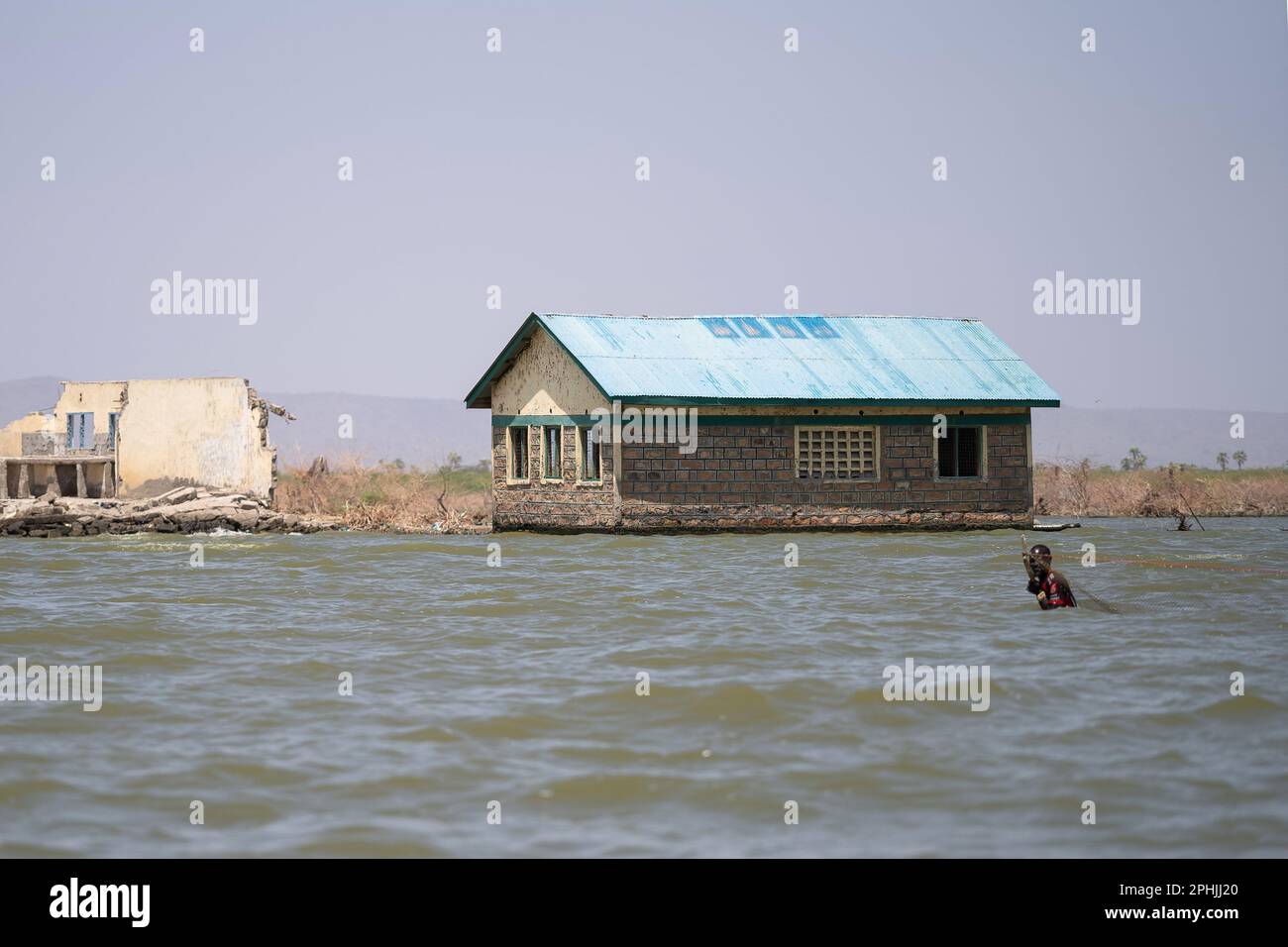 Kalokol, Kenya. 14th Feb, 2023. A Kalokol fisherman walking with his ...