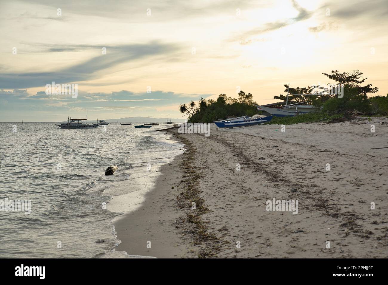 Dream idyllic beach of Pamilacan Island in the Philippines with a young ...