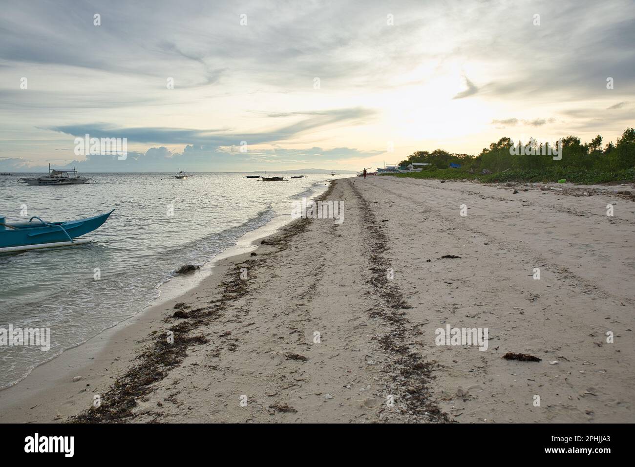 Dream idyllic beach of Pamilacan Island in the Philippines with a young ...