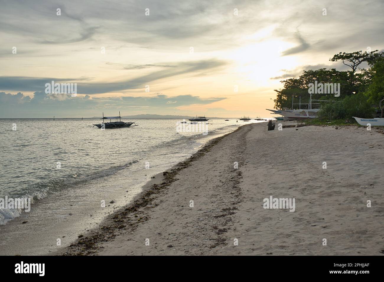 Dream idyllic beach of Pamilacan Island in the Philippines with a young ...