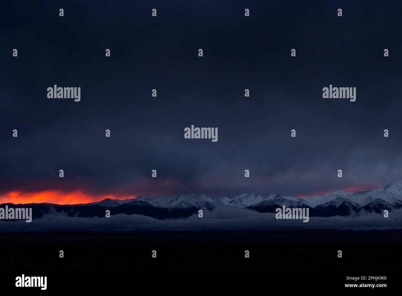 The sun setting behind the mighty Andes Mountains as seen from the Ruta ...