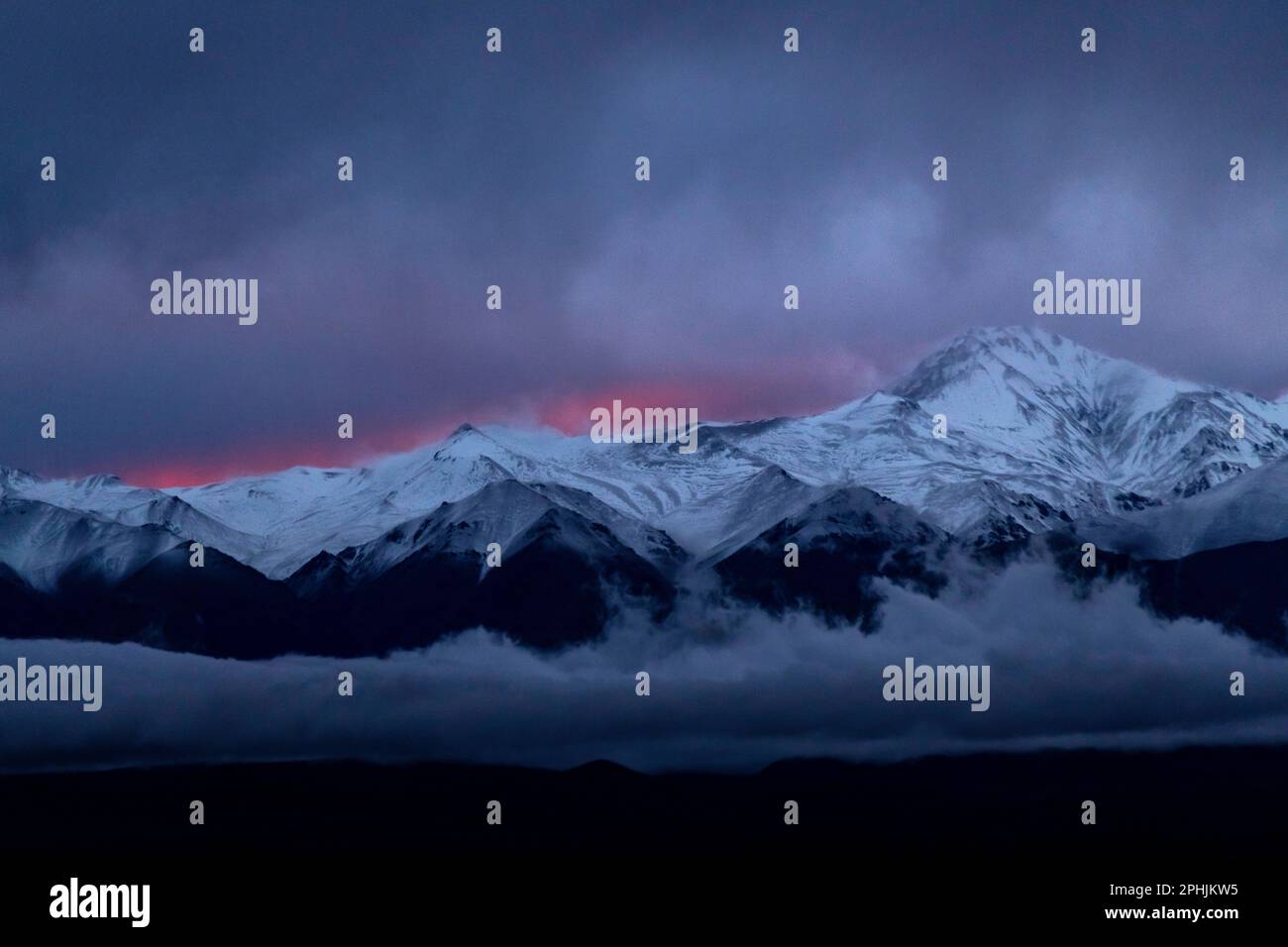 The sun setting behind the mighty Andes Mountains as seen from the Ruta ...