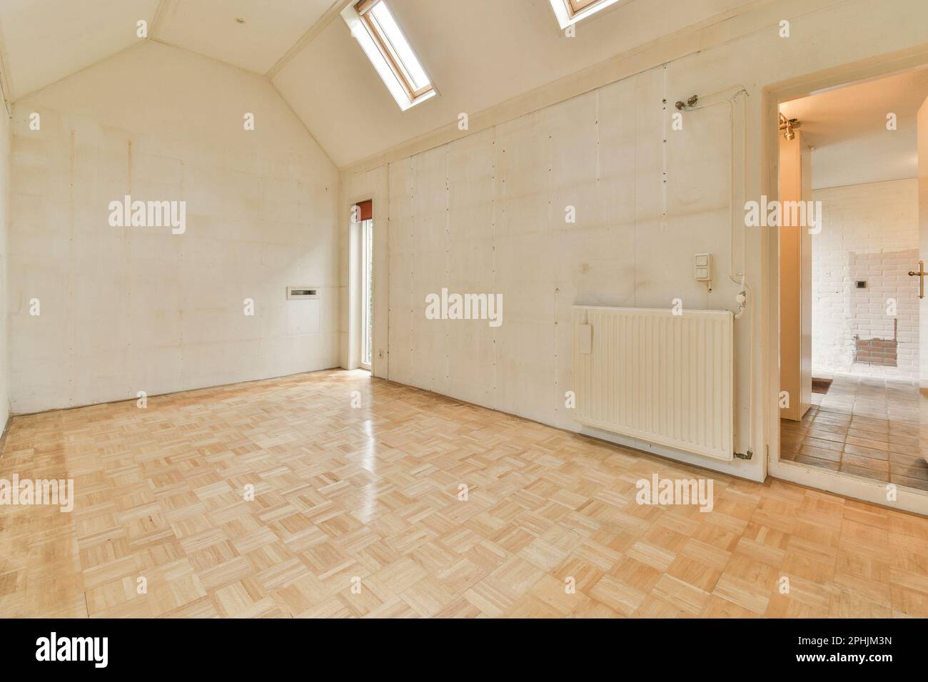 an empty room with wood flooring and white paint on the walls there is ...