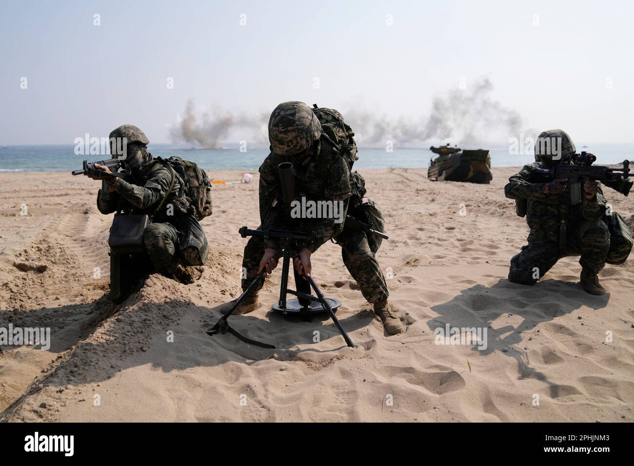 South Korean Marines take position after landing on a beach during the ...