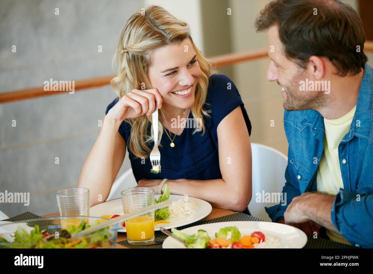 Good food, great times. a couple enjoying a meal together at home Stock ...