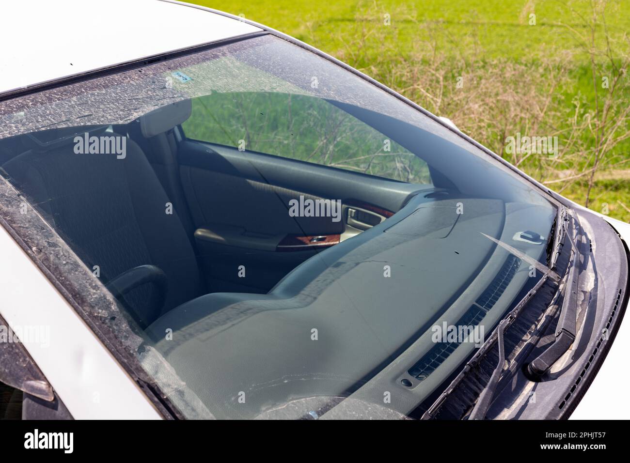 Dirty windshield of a car parked on a roadside Stock Photo - Alamy