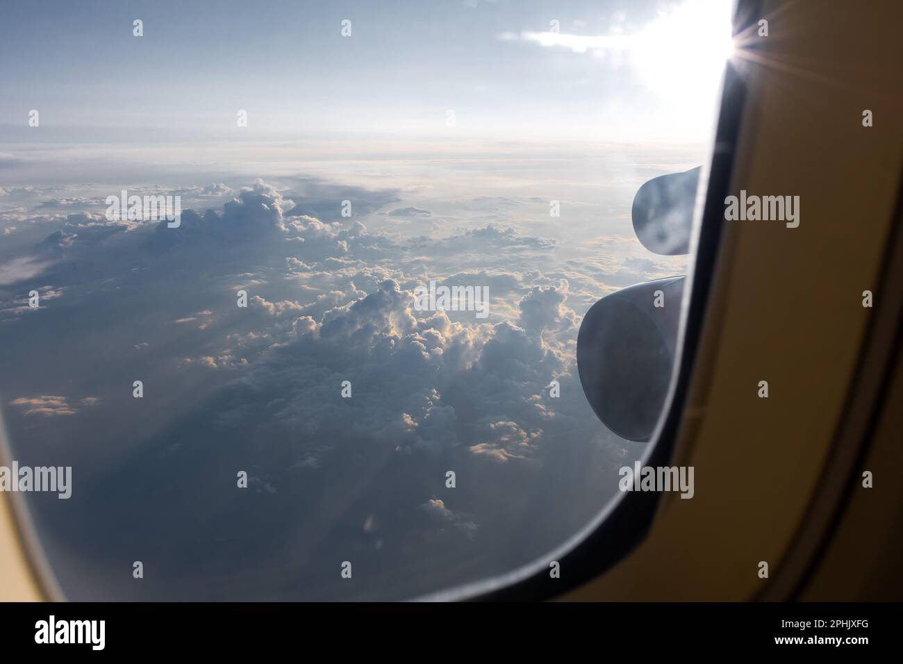 Airplane view from the window to the clouds. Solid clouds outside the ...