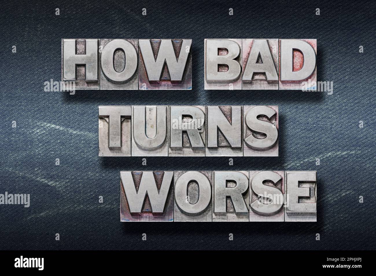 how bad turns worse phrase made from metallic letterpress on dark jeans ...