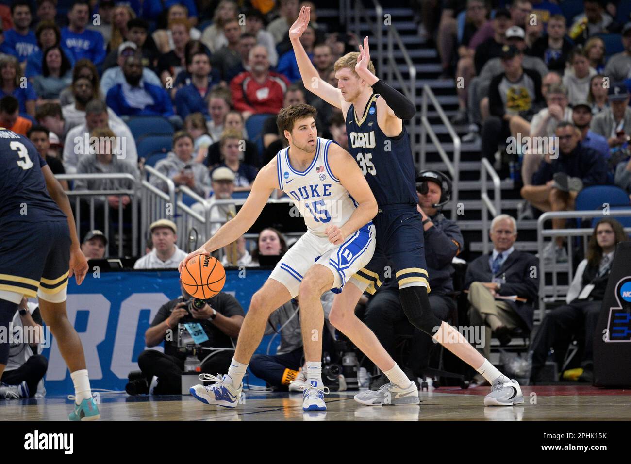 Duke center Ryan Young (15) is defended by Oral Roberts forward Connor ...