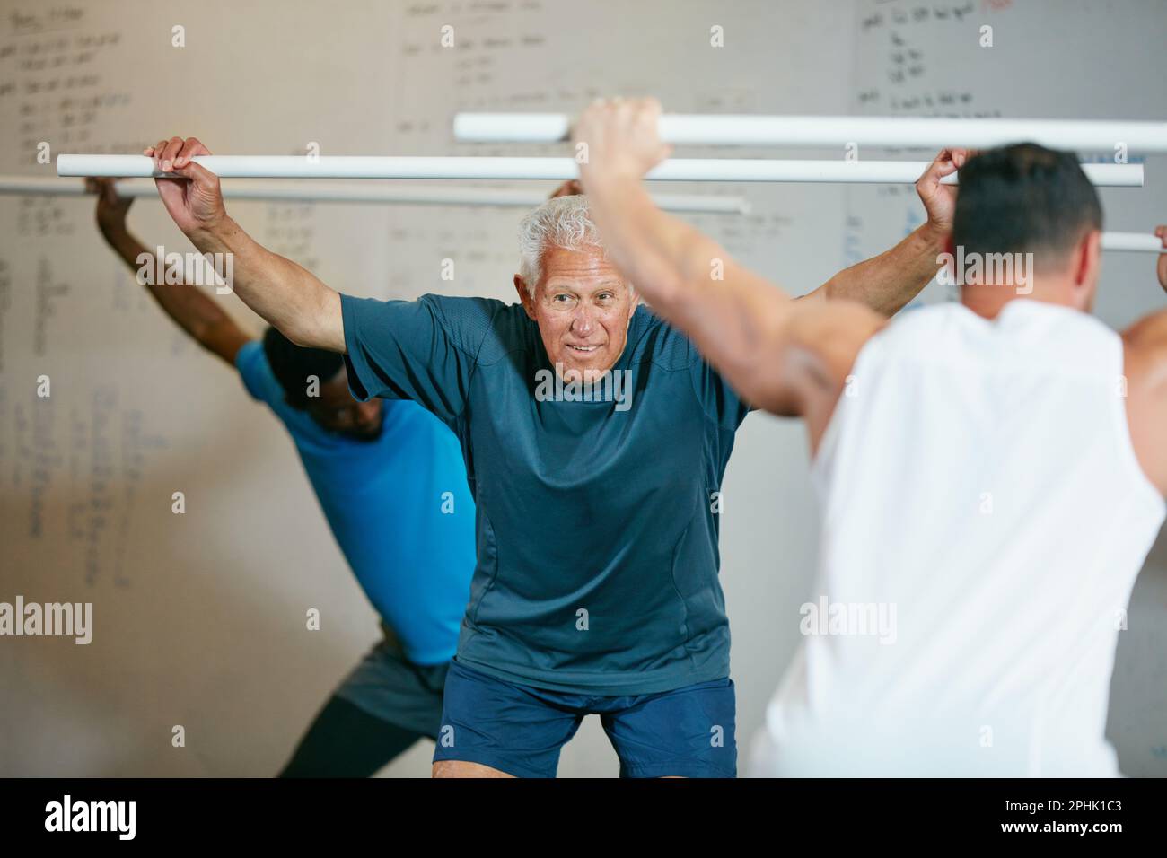 Stay fit in your senior years. a fitness group doing pvc exercises at ...
