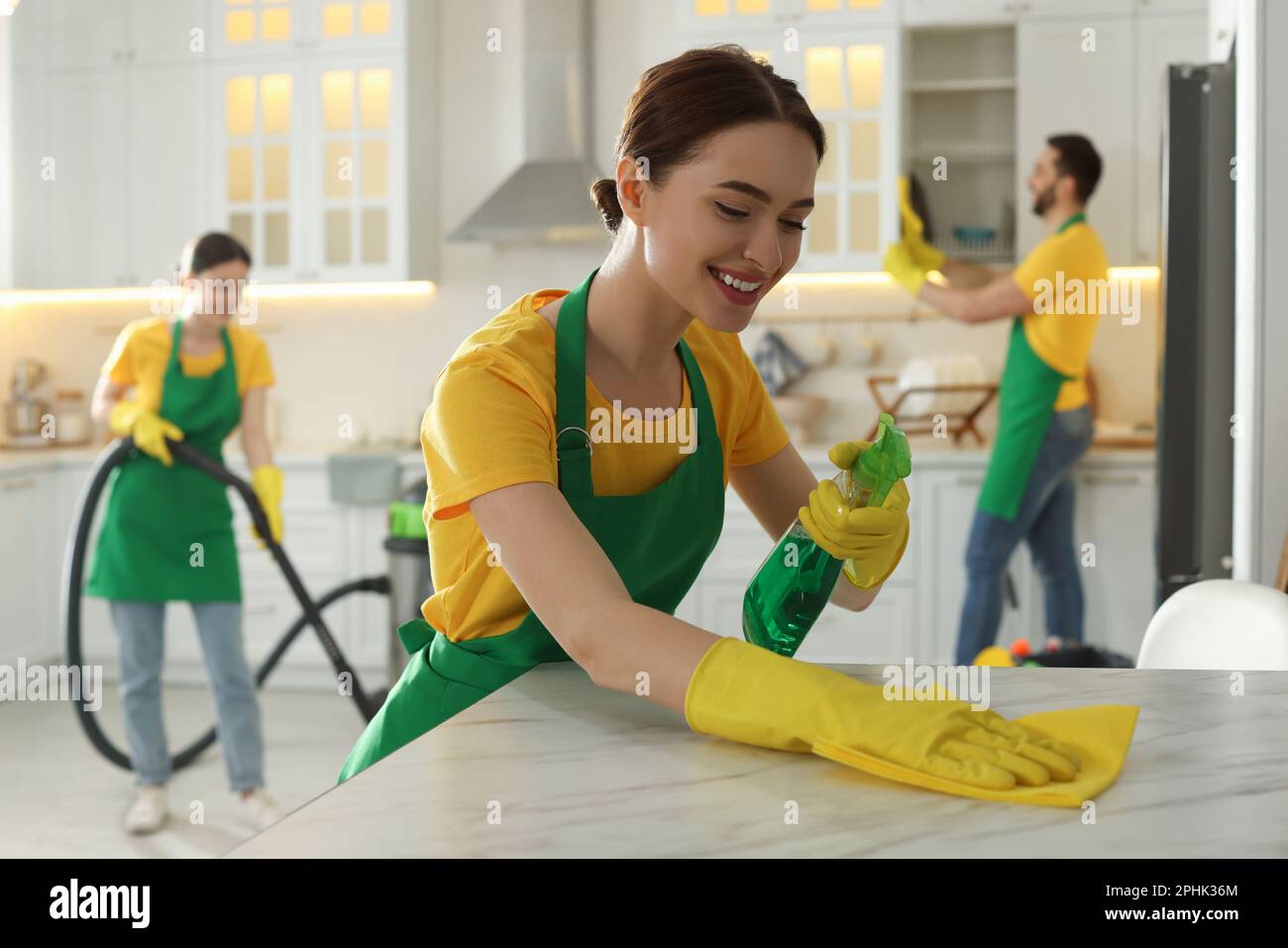 Group young female janitors hi-res stock photography and images - Alamy