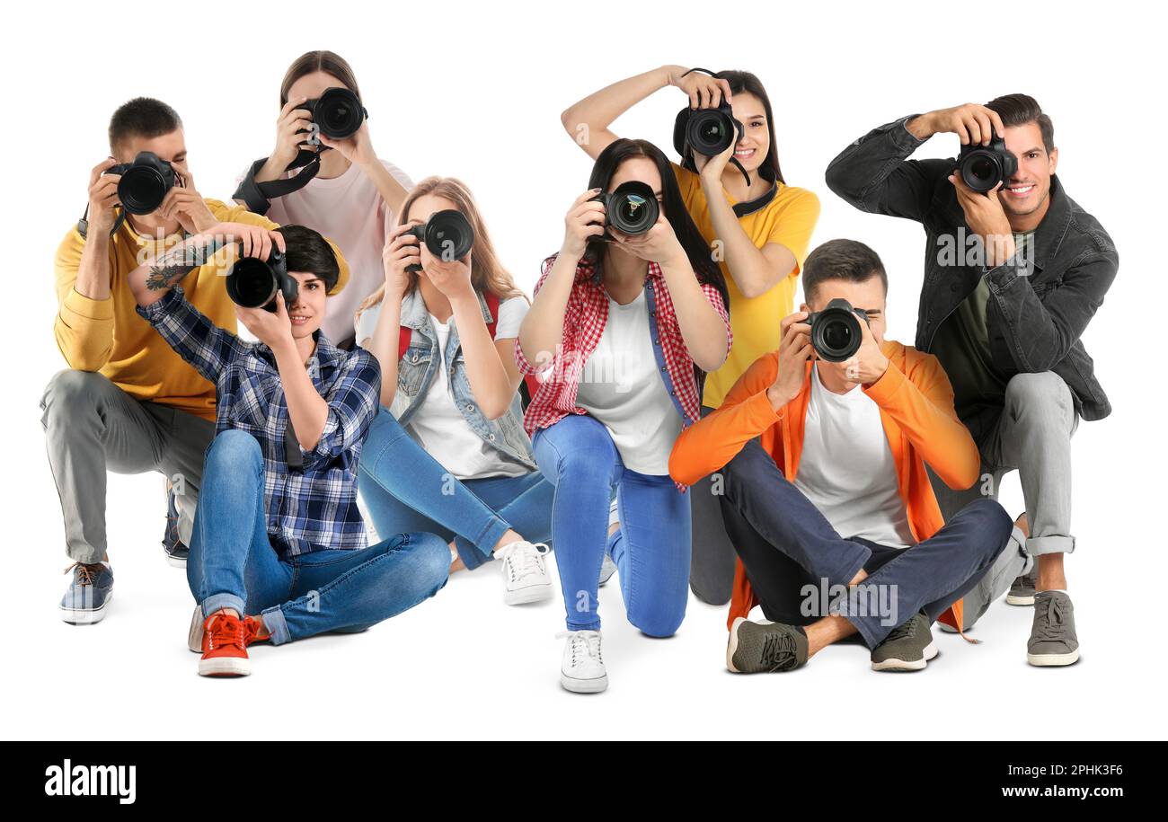 Group of professional photographers with cameras on white background ...