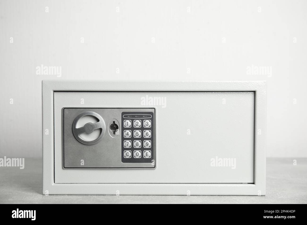 Steel safe with electronic lock on white background Stock Photo - Alamy