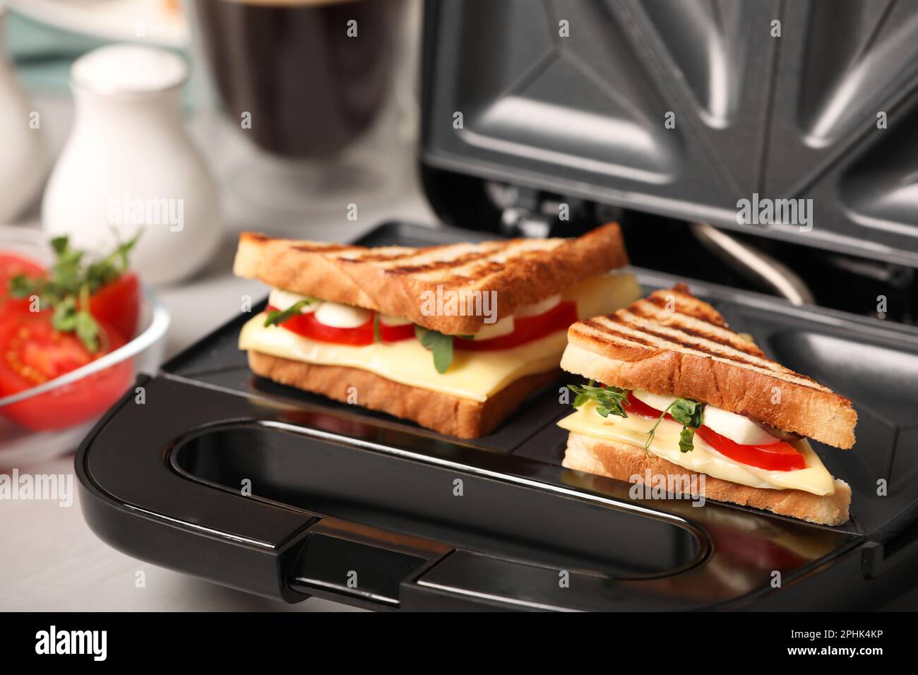 Modern grill maker with sandwiches on table, closeup view Stock Photo ...