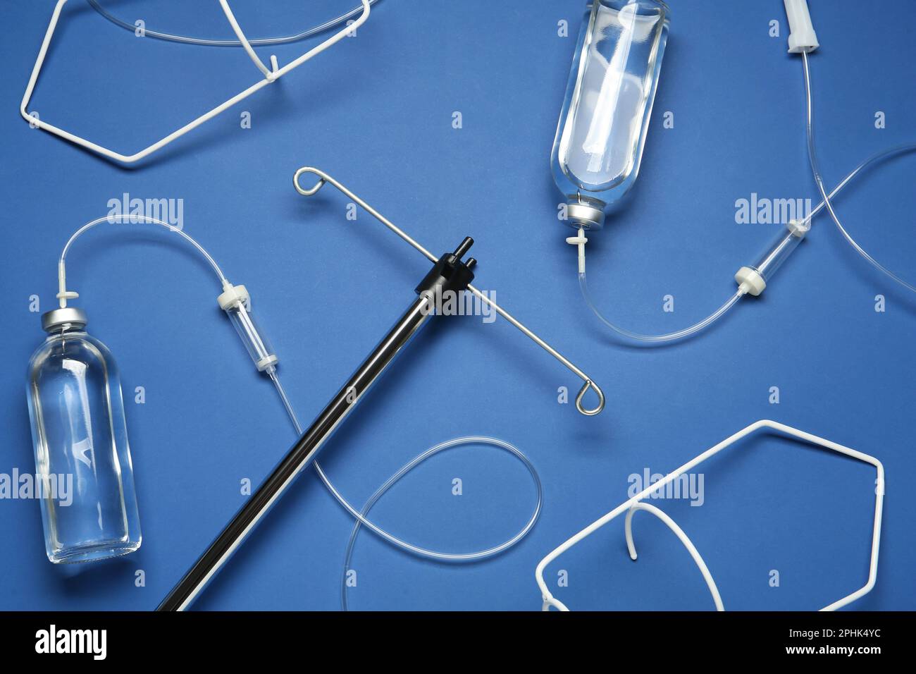 IV infusion set on blue background, flat lay Stock Photo - Alamy