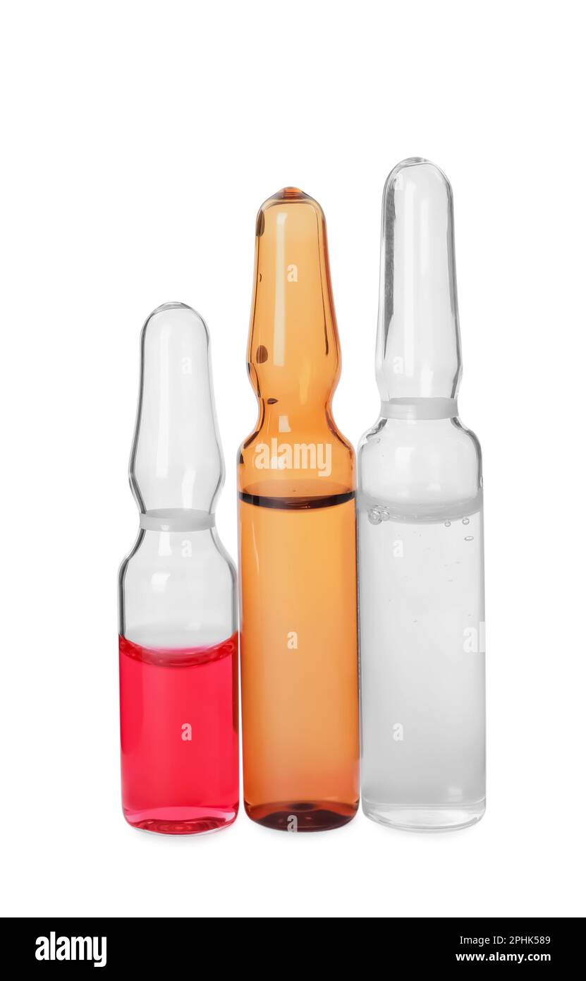 Different ampoules with pharmaceutical products on white background ...