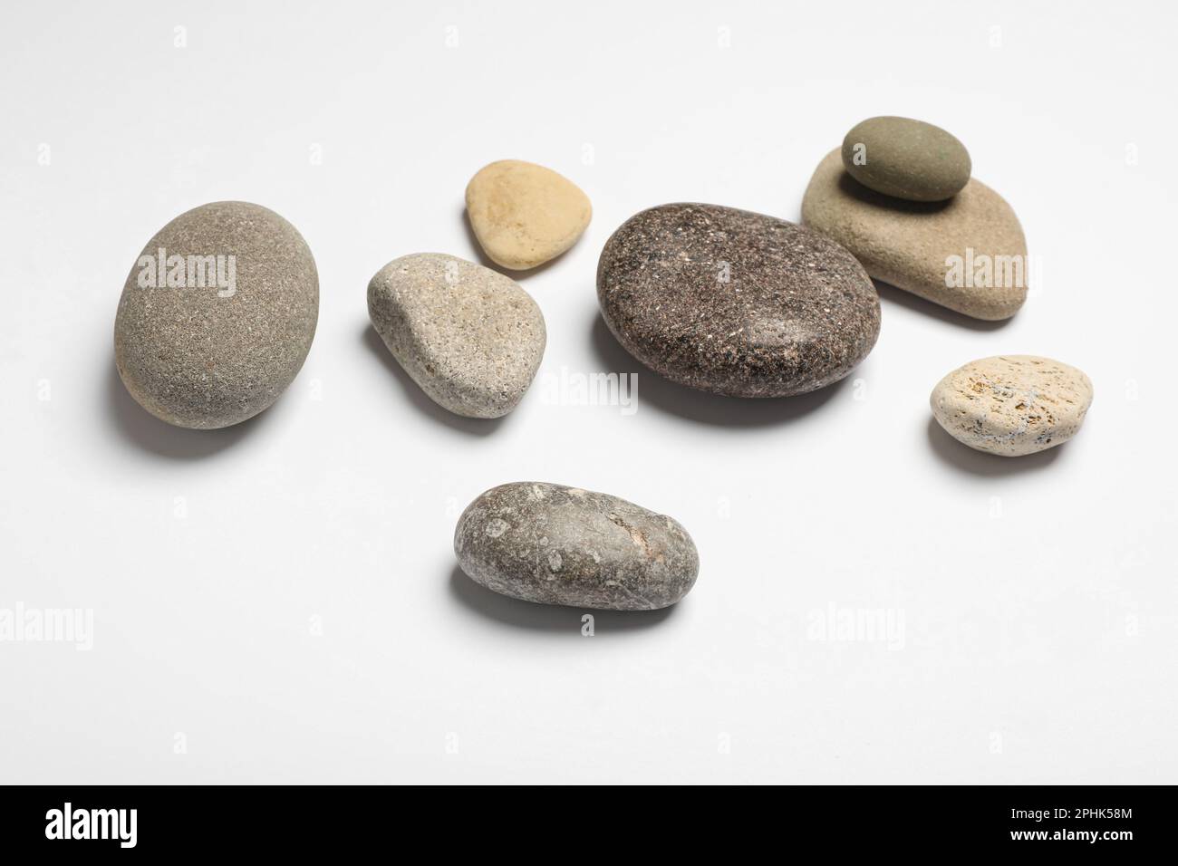 Group of different stones on white background Stock Photo - Alamy