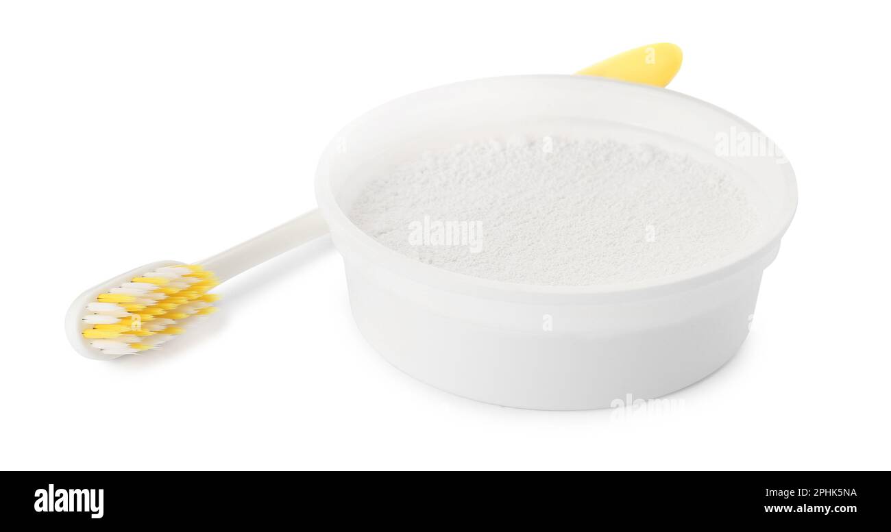 Bowl of tooth powder and brush on white background Stock Photo - Alamy