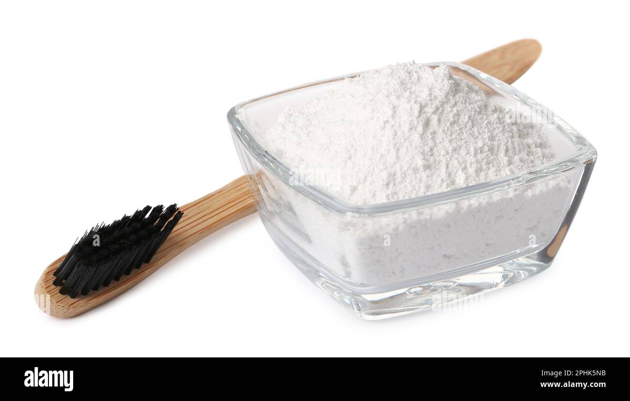 Glass bowl of tooth powder and brush on white background Stock Photo ...