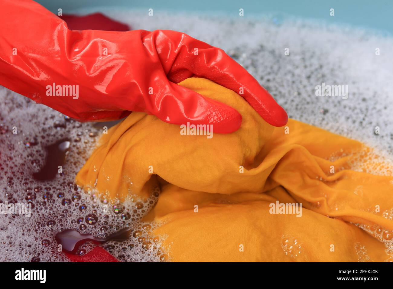 Woman washing clothes in basin hi-res stock photography and images - Alamy