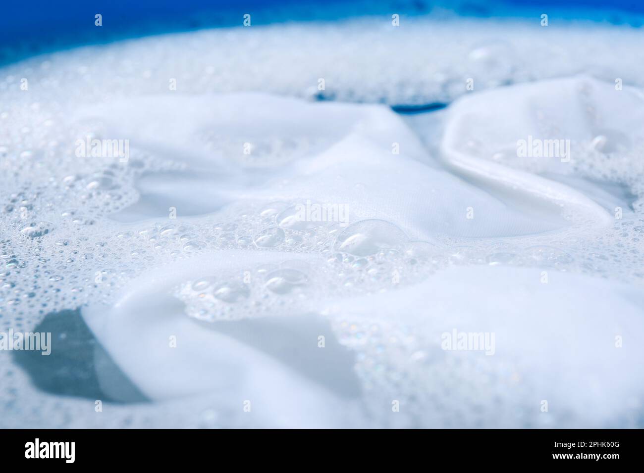 White garment in suds, closeup. Hand washing laundry Stock Photo - Alamy