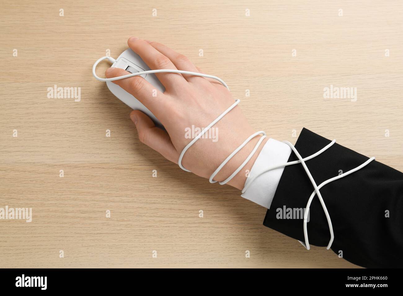 Internet addiction. Top view of man using computer mouse cable at ...