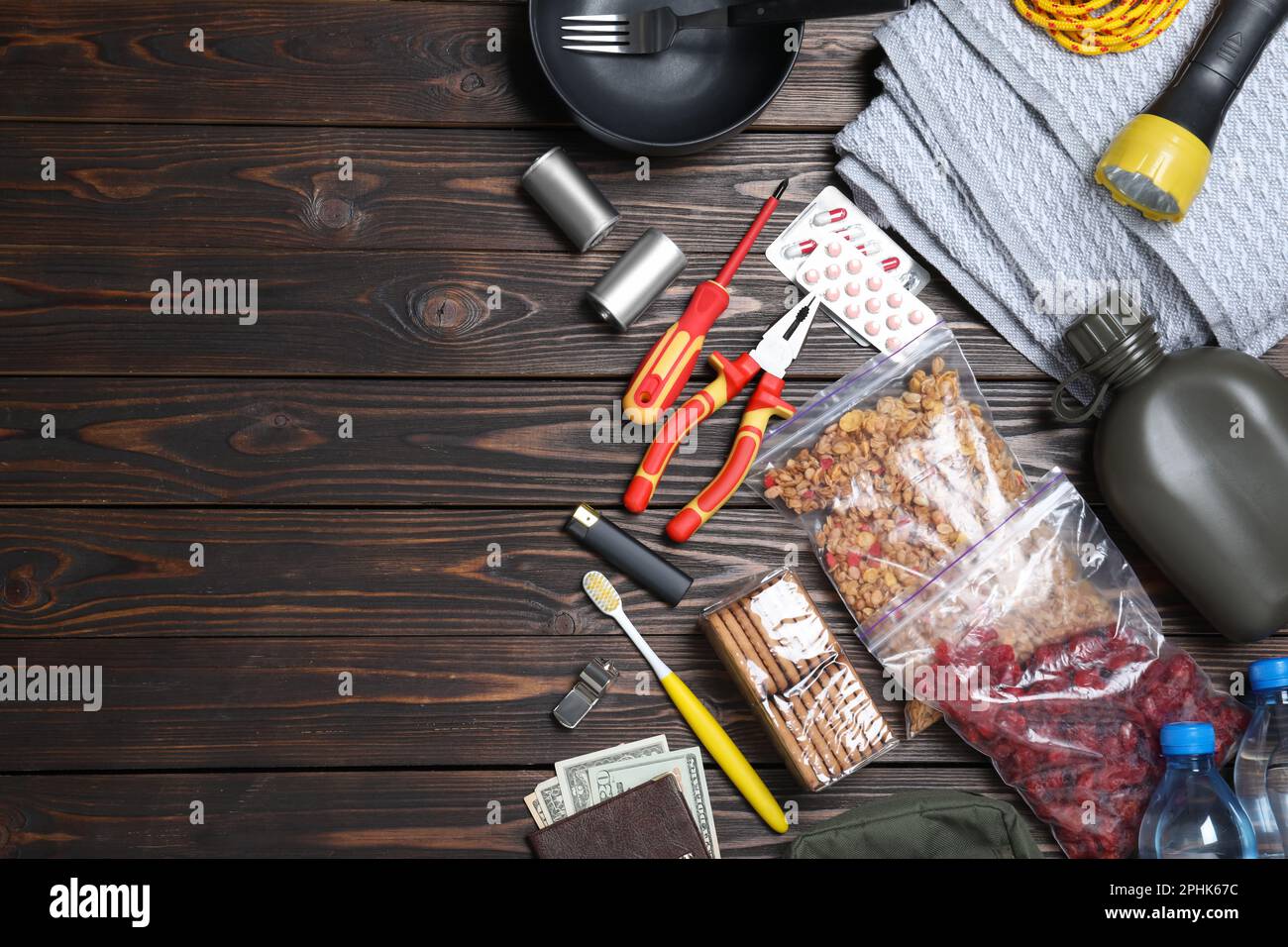 Earthquake supply kit on wooden table, flat lay. Space for text Stock ...