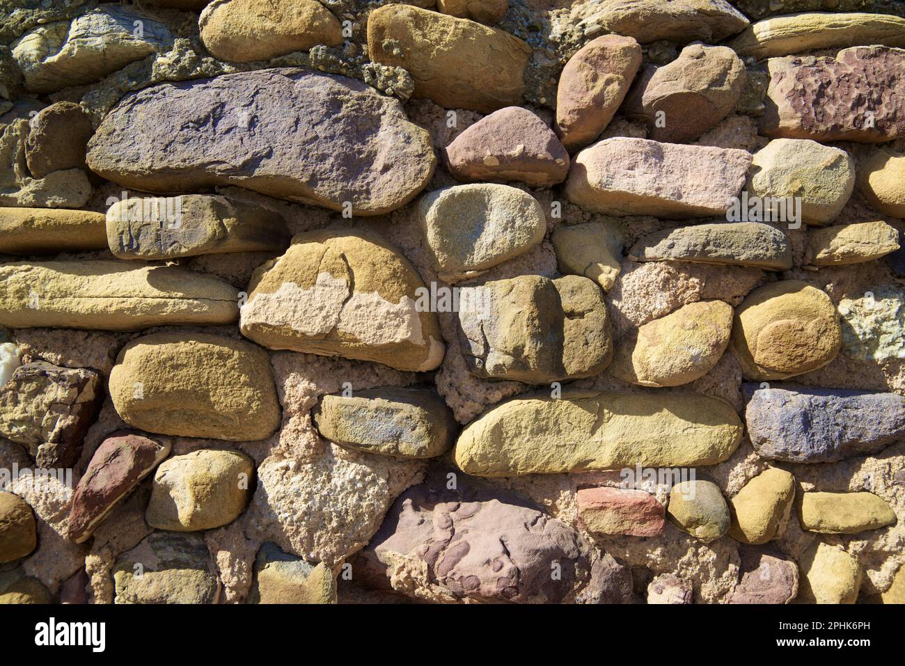 Texture of an old stone wall in Spain Stock Photo - Alamy