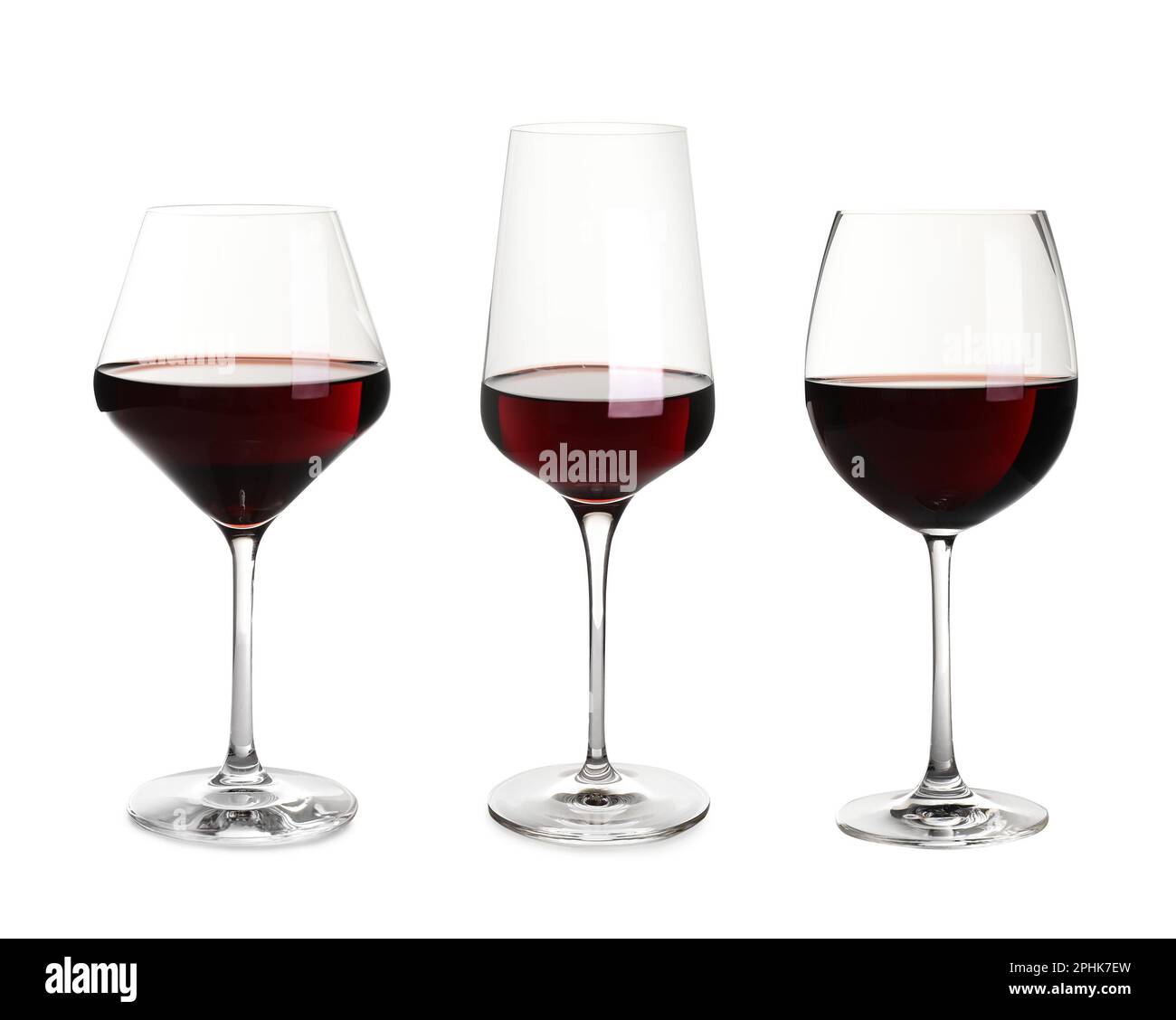 Set with glasses of delicious expensive red wine on white background ...