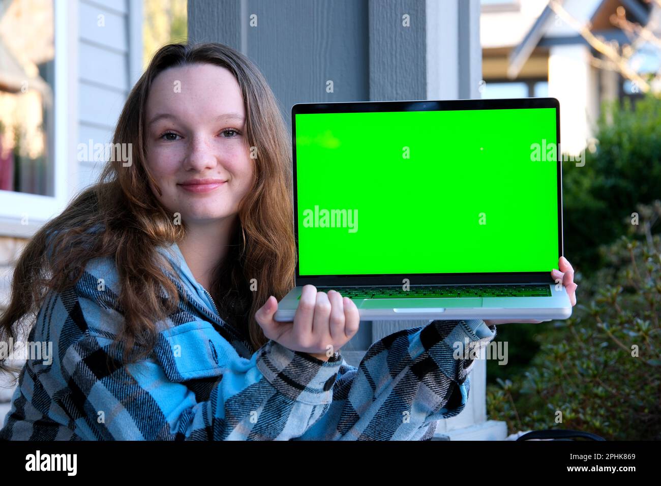 beautiful teenage girl in hands with laptop green screen chroma key ...