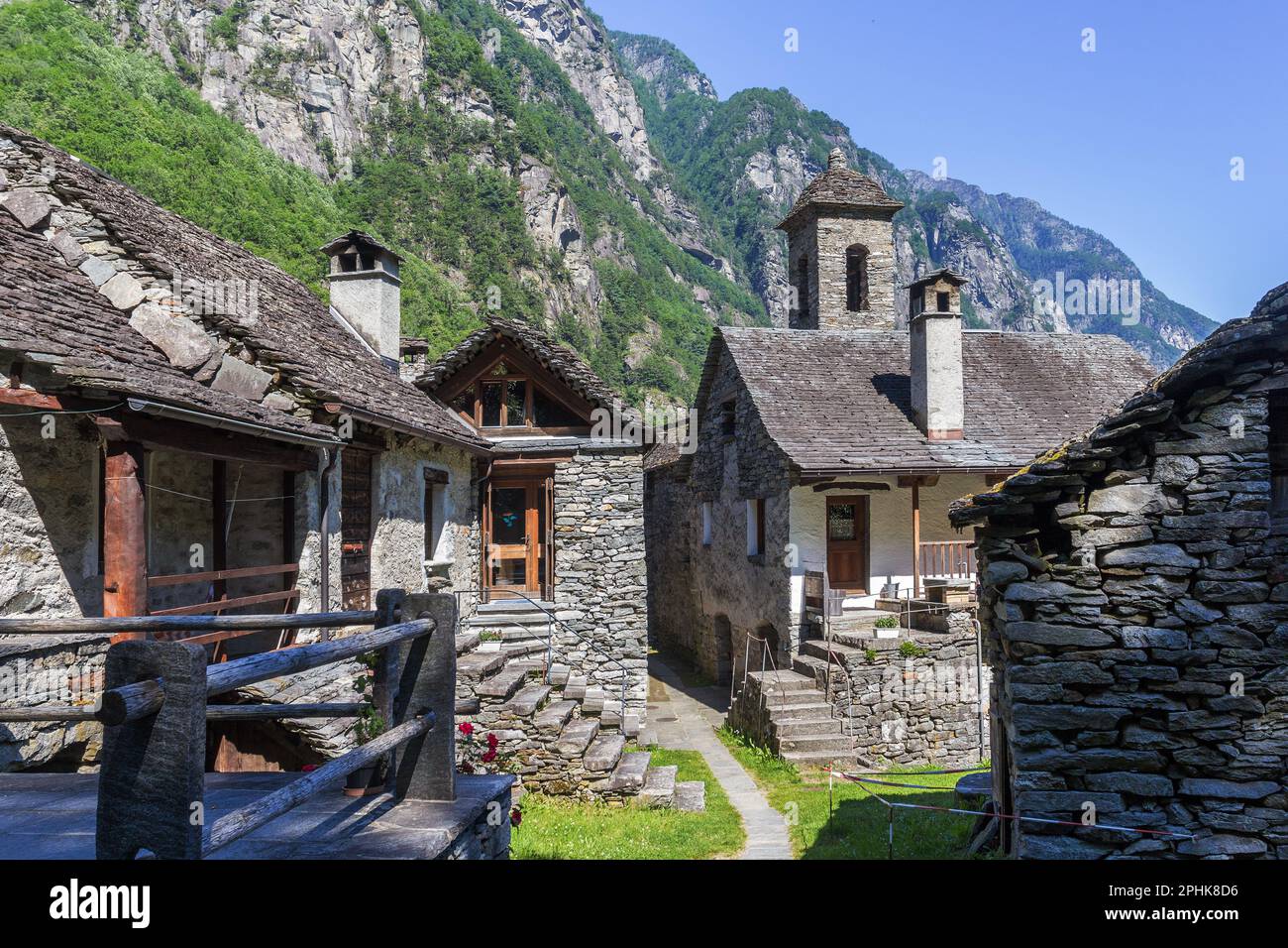 The tradtional stone houses with church tower in the beautiful village ...