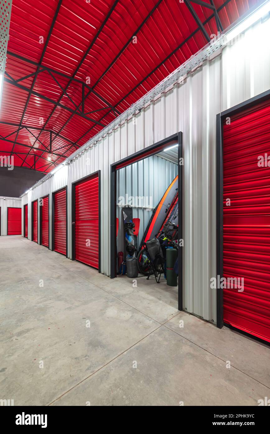 Corridor of self storage unit with red doors. Rental Storage Units ...