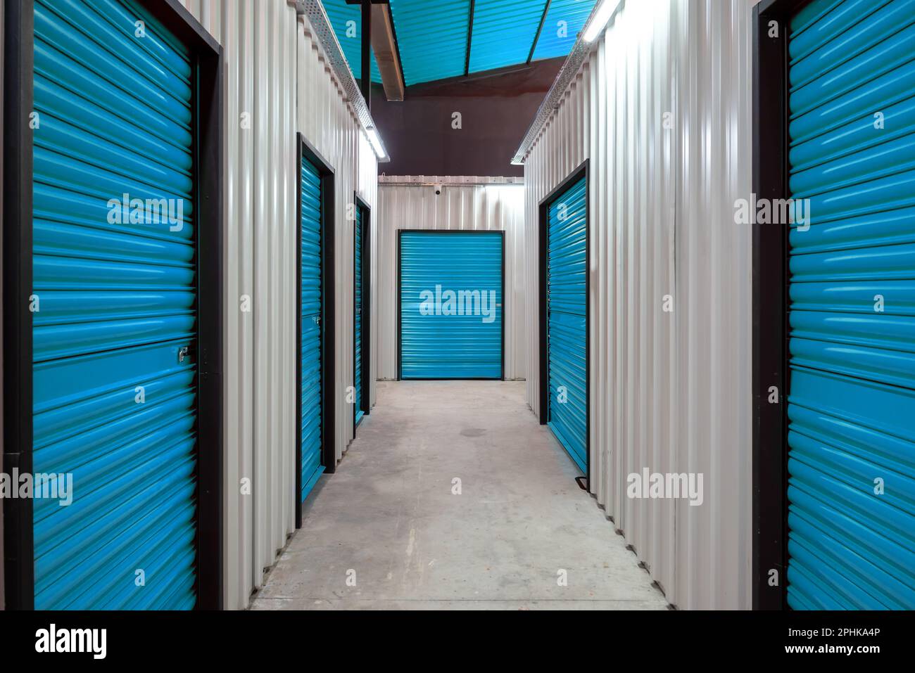 Corridor of self storage unit with blue doors. Rental Storage Units ...