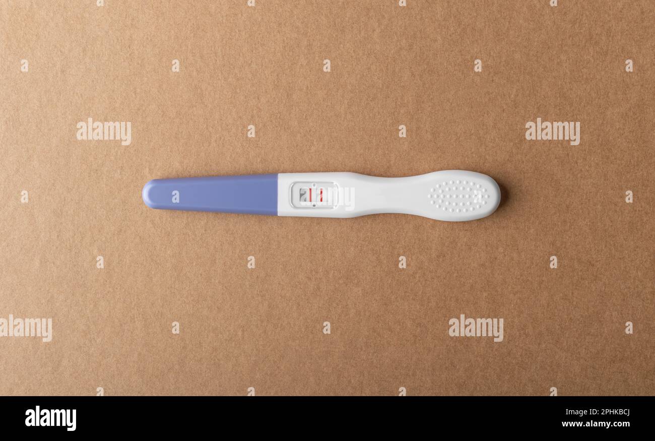 Pregnancy test on a neutral background Stock Photo - Alamy
