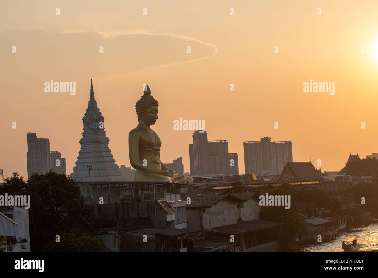aerial view golden big Buddha Wat Paknam Phasi Charoen in sunset ...
