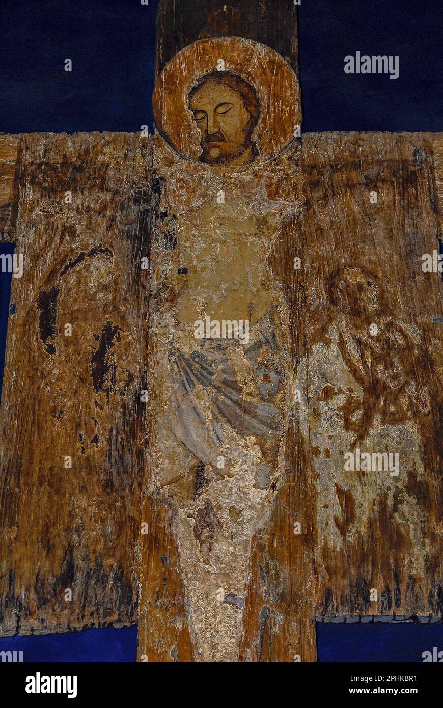 Face of Jesus Christ on the Cross with eyes shut, painted on a wooden halo disc in Byzantine ...