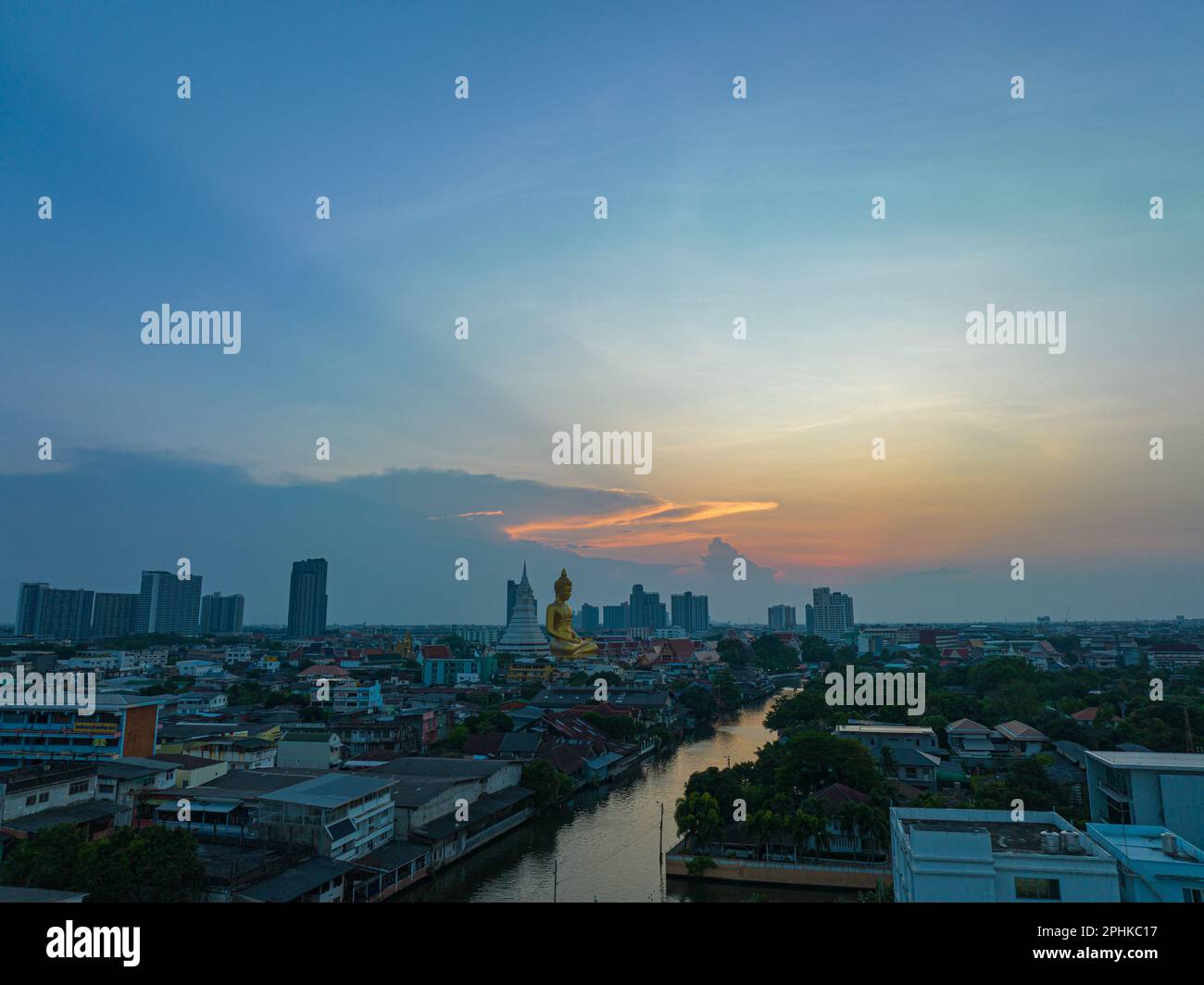aerial view golden big Buddha Wat Paknam Phasi Charoen in sunset ...
