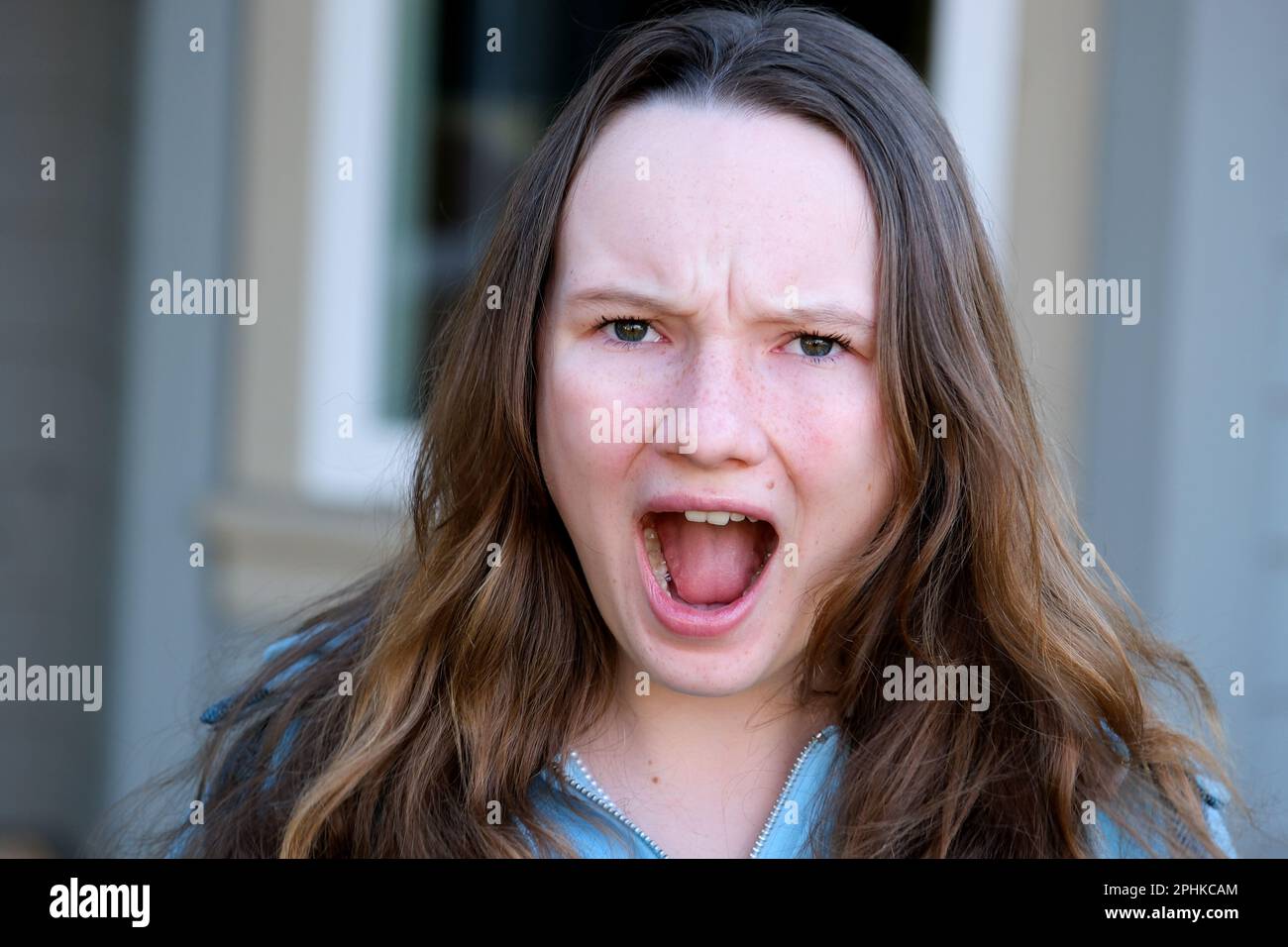 angry dissatisfied teenage girl screaming loudly with mouth open frown ...