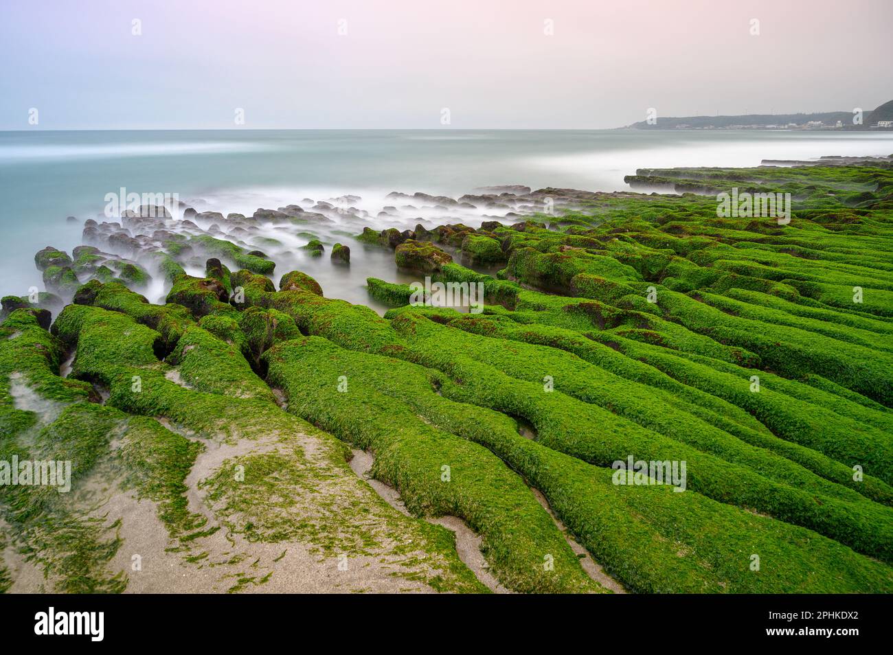 White waves wash over mossy brown rocks. Explore breathtaking coastal ...