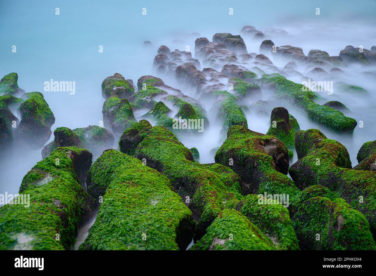 White waves wash over mossy brown rocks. Explore breathtaking coastal ...