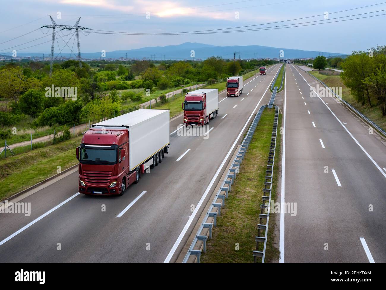 Large Red Lorry Trucks with containers on highway, cargo transportation ...