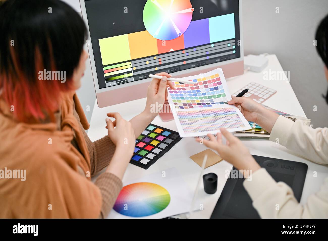 Close-up image of two female graphic designers planning a new project ...