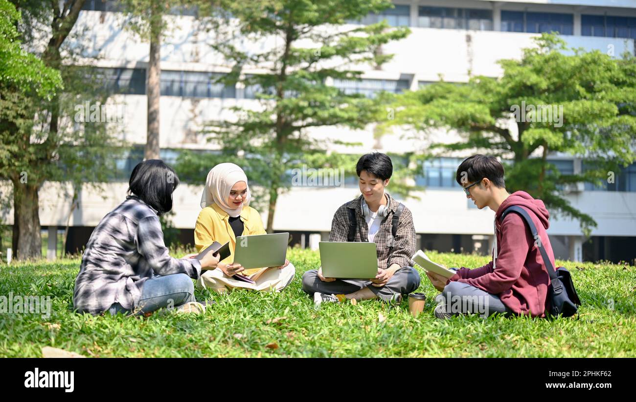 A group of happy and smart young Asian-diverse college students are ...