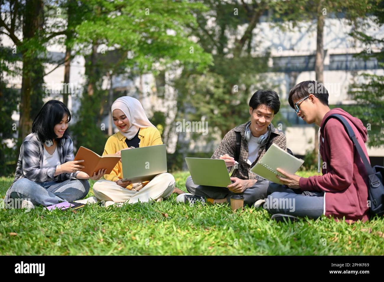 A group of smart young Asian-diverse college students are sharing their ...