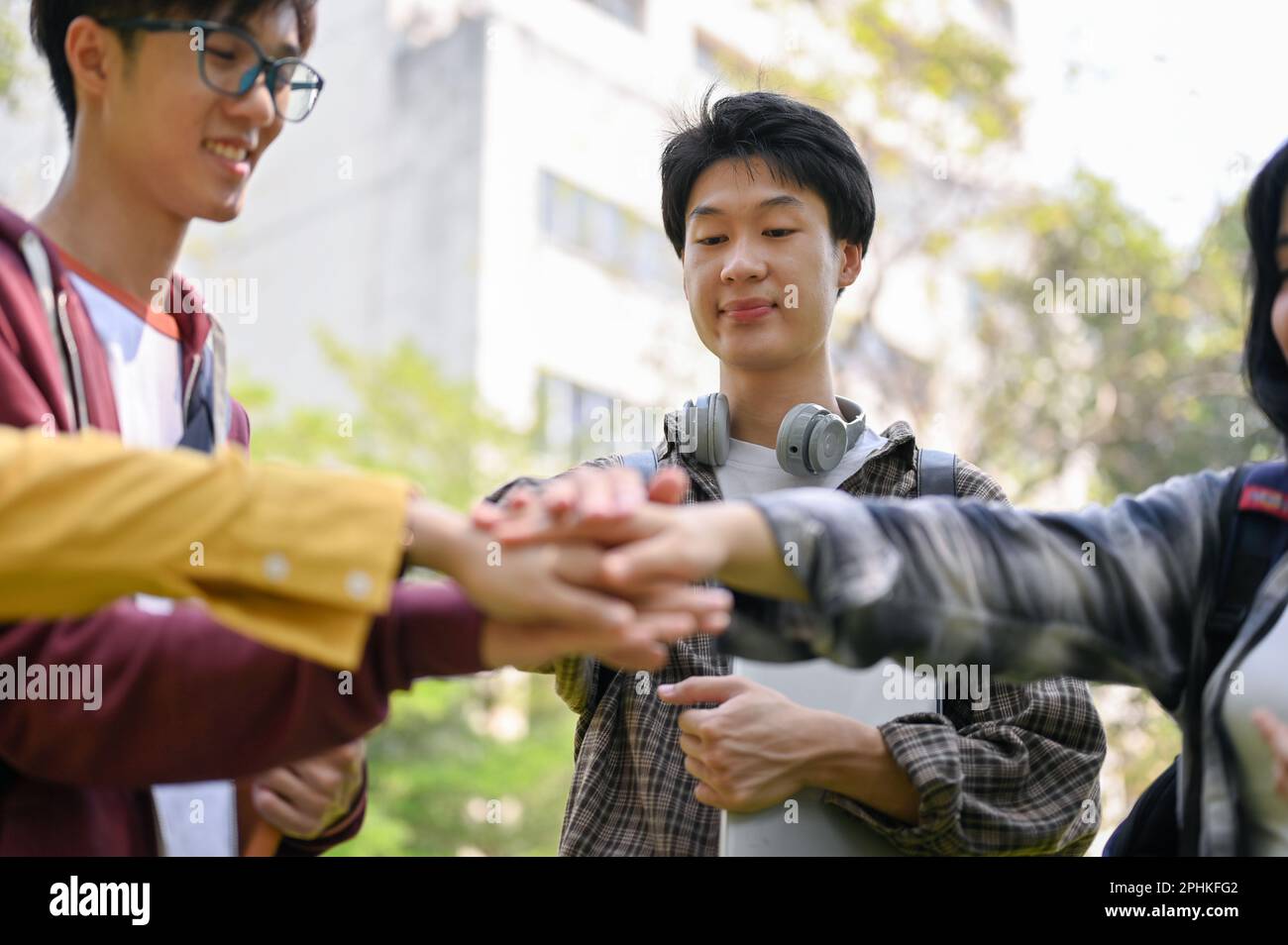 Close-up image of a group of young Asian-diverse college students are ...
