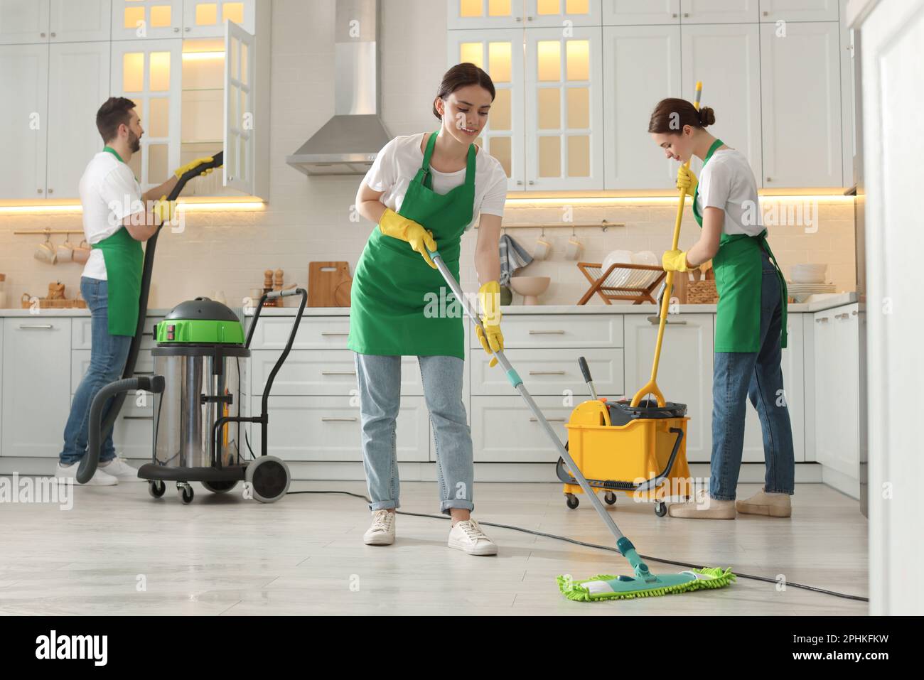 Group young female janitors hi-res stock photography and images - Alamy