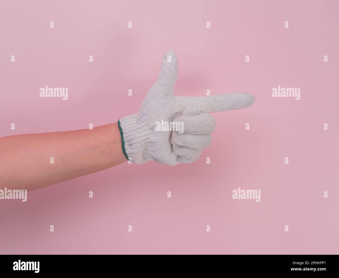 Hands in white knitted gloves isolated on pink background. Female hand ...