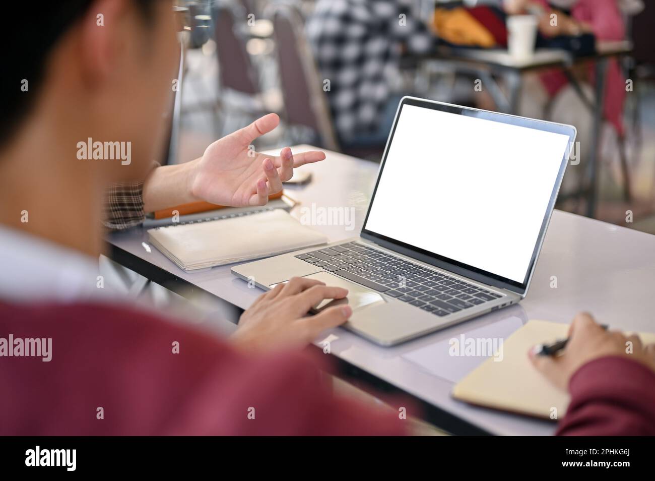Close-up image of a young Asian male college student using laptop and ...