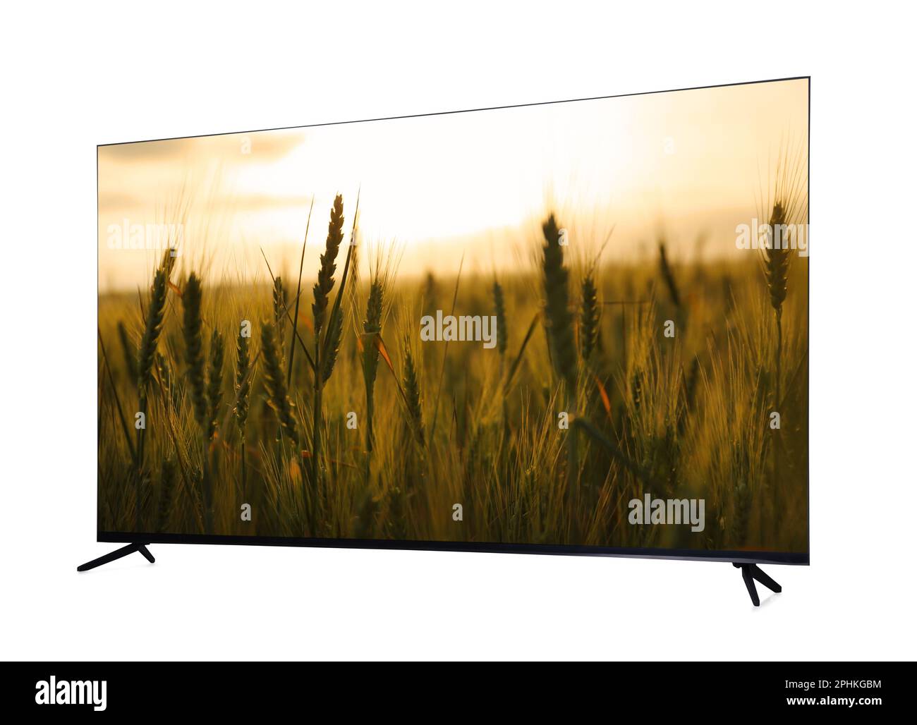 Modern wide screen TV monitor showing beautiful wheat field at sunset ...