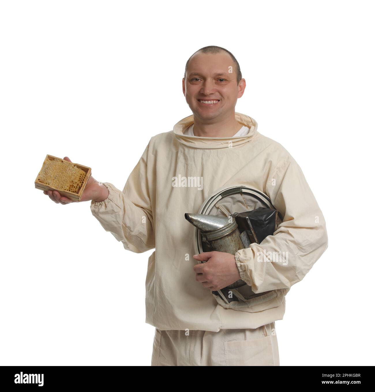 Beekeeper in uniform holding smokepot and hive frame with honeycomb on ...